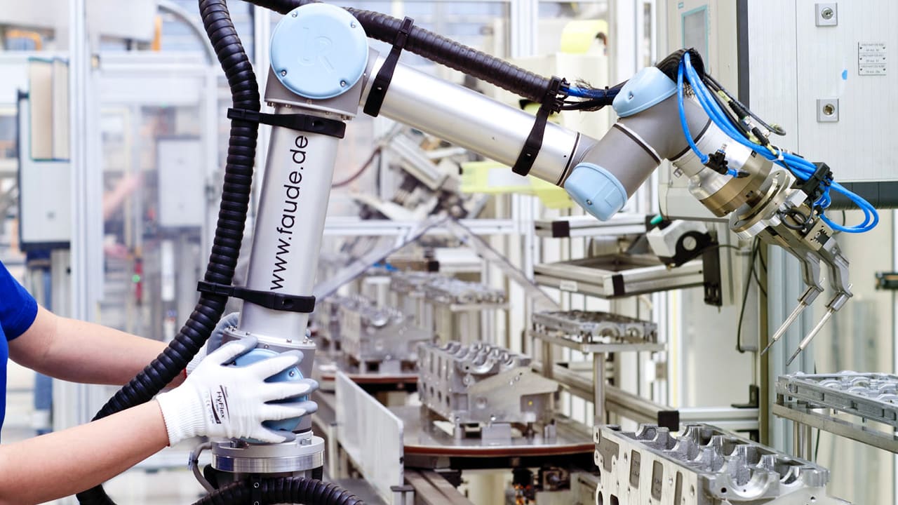 At Volkswagen, Robots Are Coming Out Of Their Cages