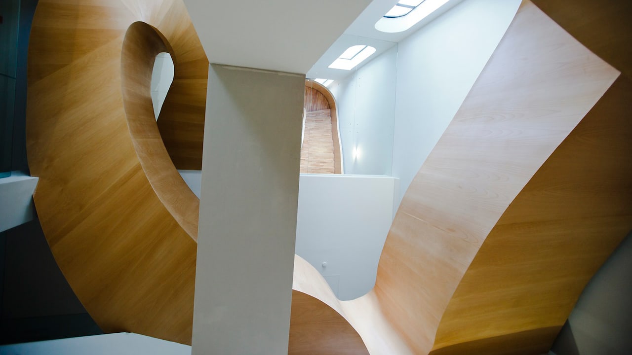 A $1 Million Staircase Snakes Through A Building’s Every Cranny