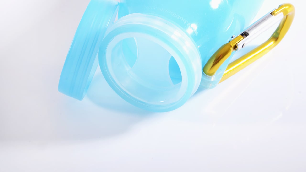 A Collapsible Water Bottle That Fits In The Palm Of Your Hand