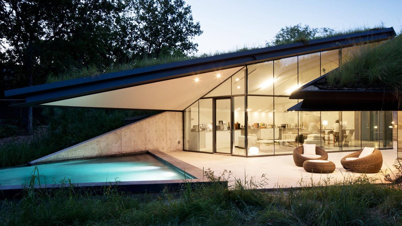 A Futuristic House That Seems To Rise From The Earth