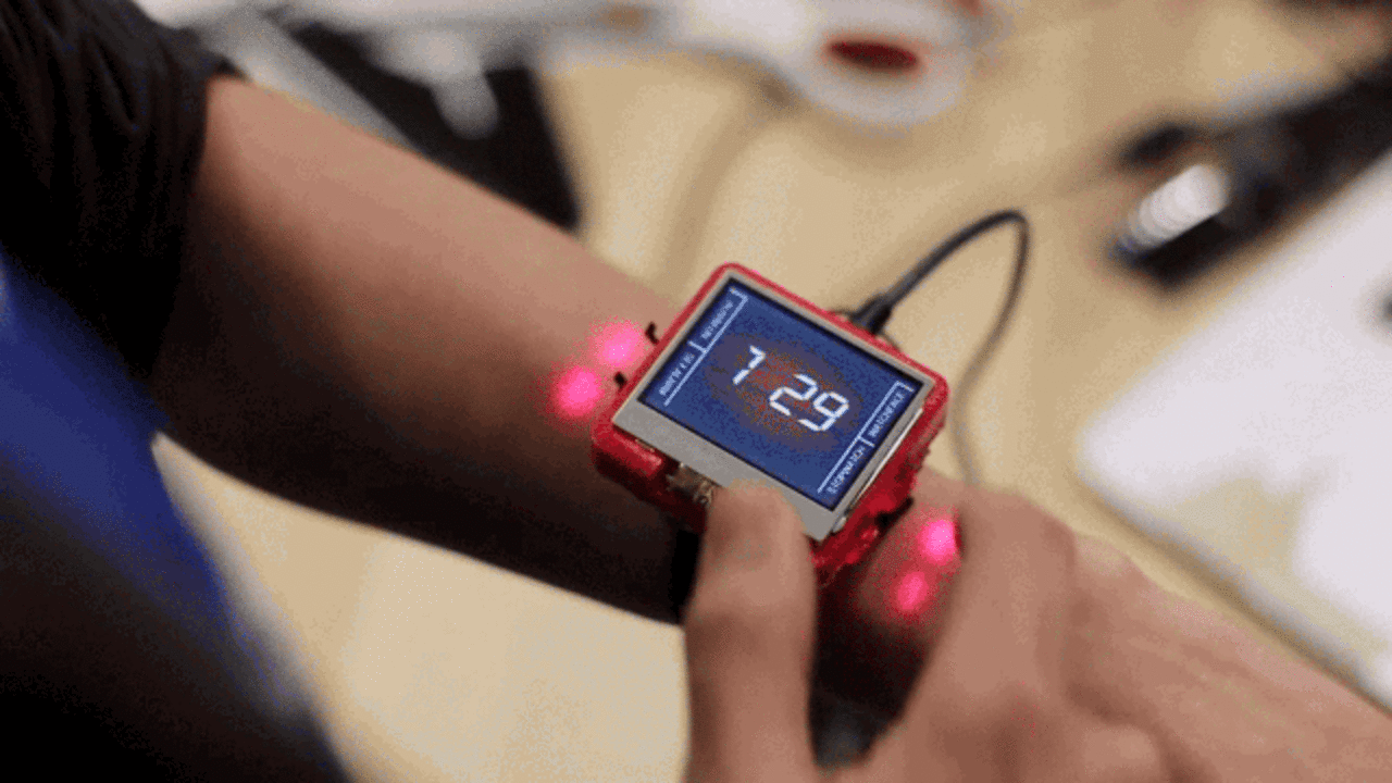 This Smartwatch Projects Laser Buttons Onto Your Skin