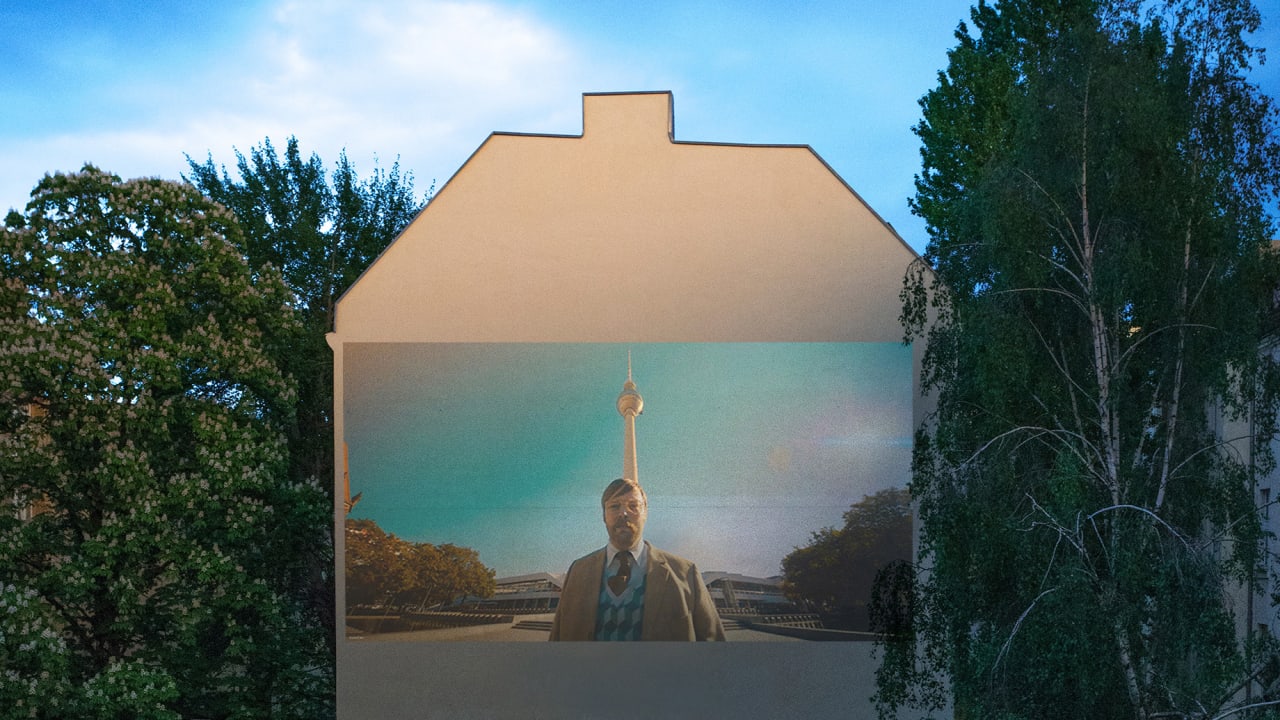 Berlin residents watch films projected on building exteriors