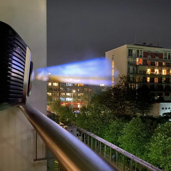 Berlin residents watch films projected on building exteriors